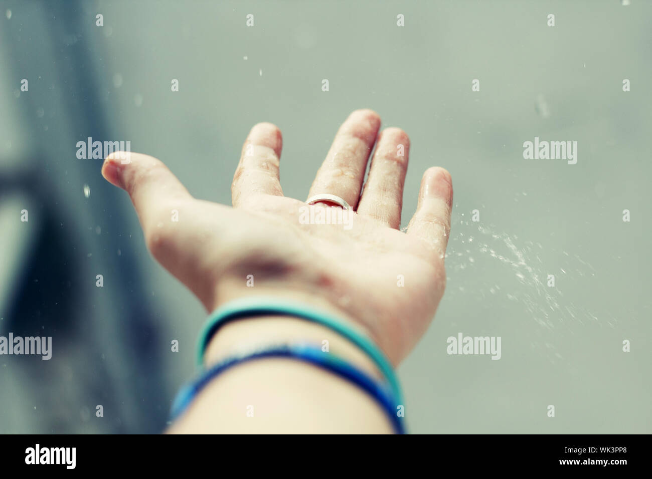 Wet hand hi-res stock photography and images - Alamy