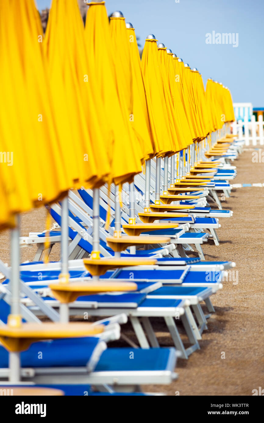 sun beds in a row on beach Stock Photo - Alamy