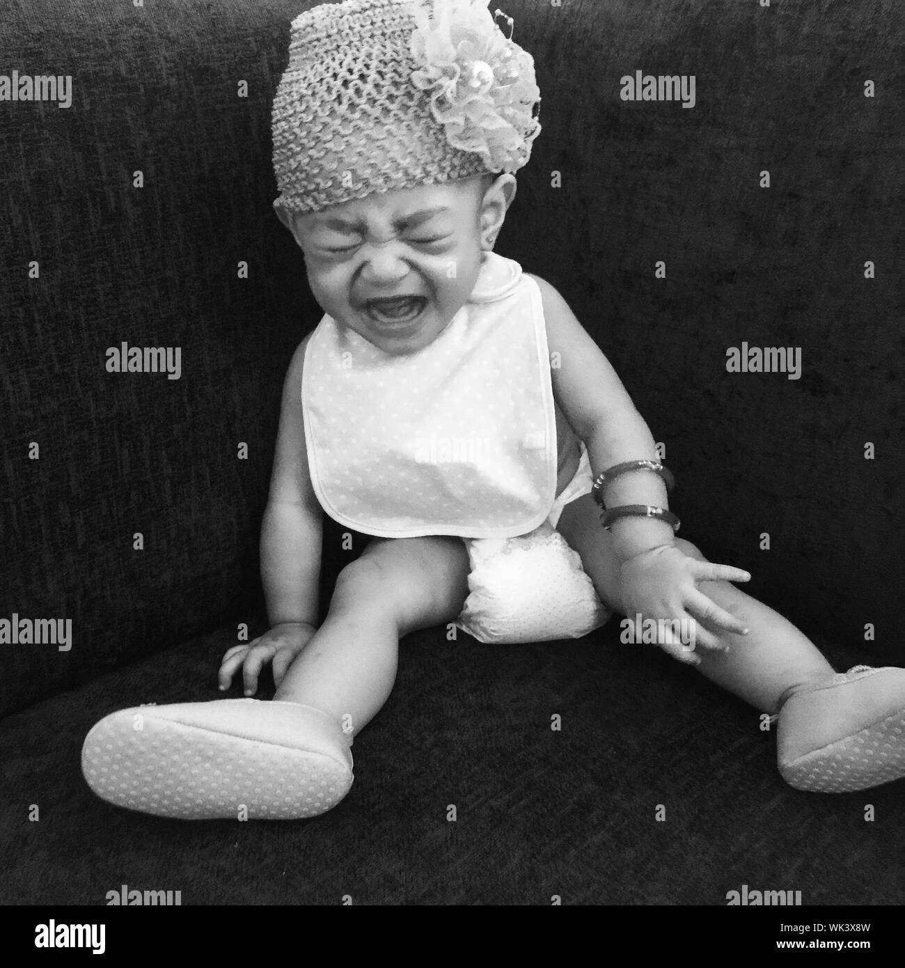 Sitting baby crying hi-res stock photography and images - Alamy
