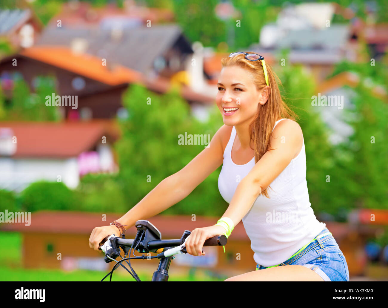 Lady on bicycle in park hi-res stock photography and images - Alamy