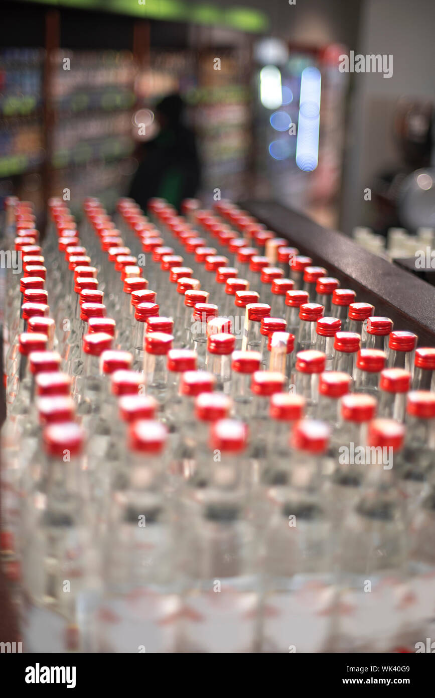 Bottles of vodka stand in a row in the store Stock Photo - Alamy