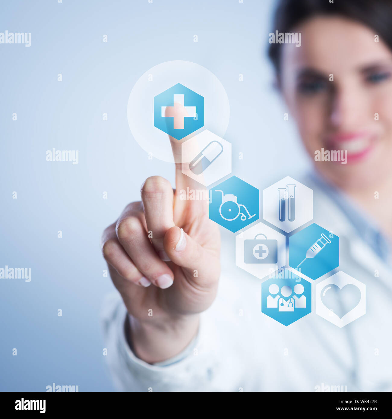 Young female doctor using a touch screen interface Stock Photo - Alamy