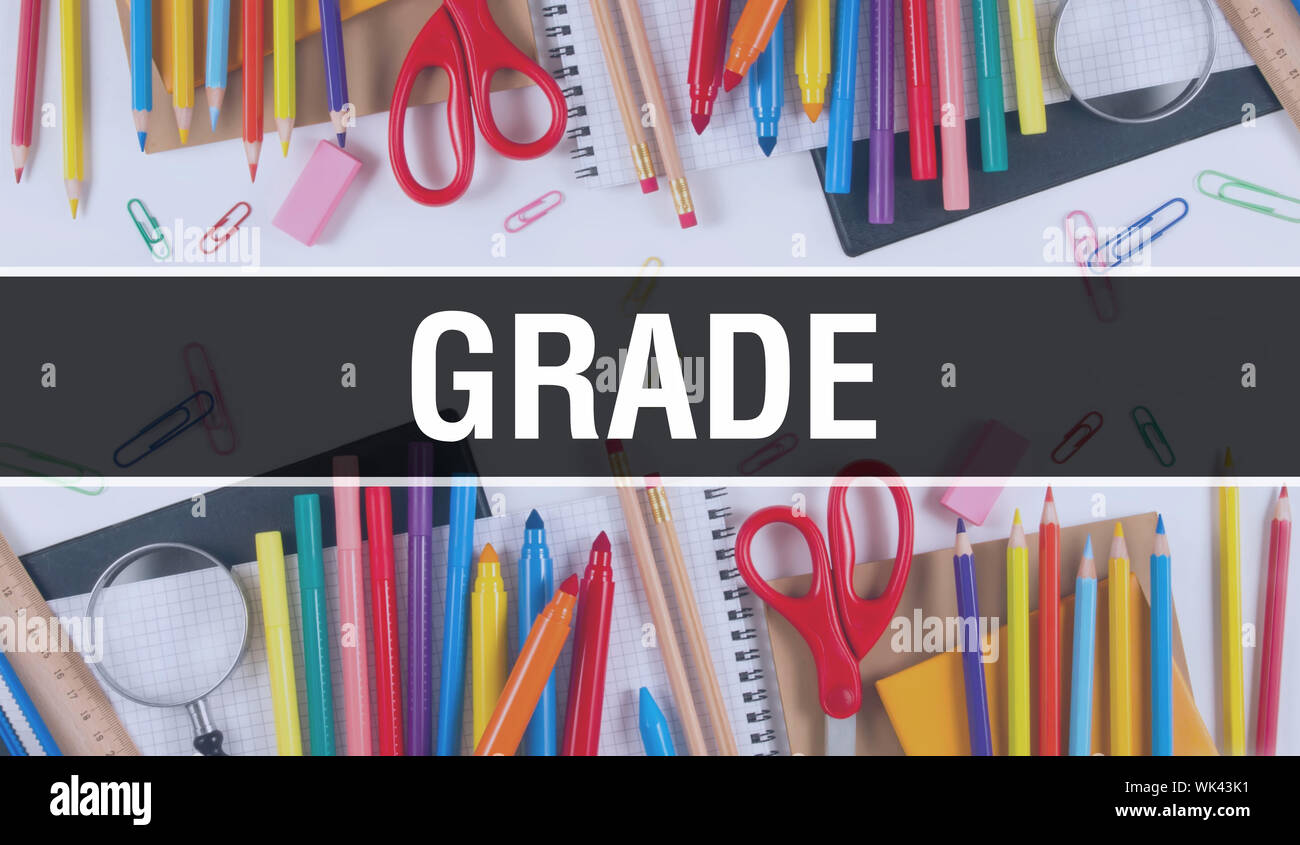 grade with School supplies on blackboard Background. grade text on ...
