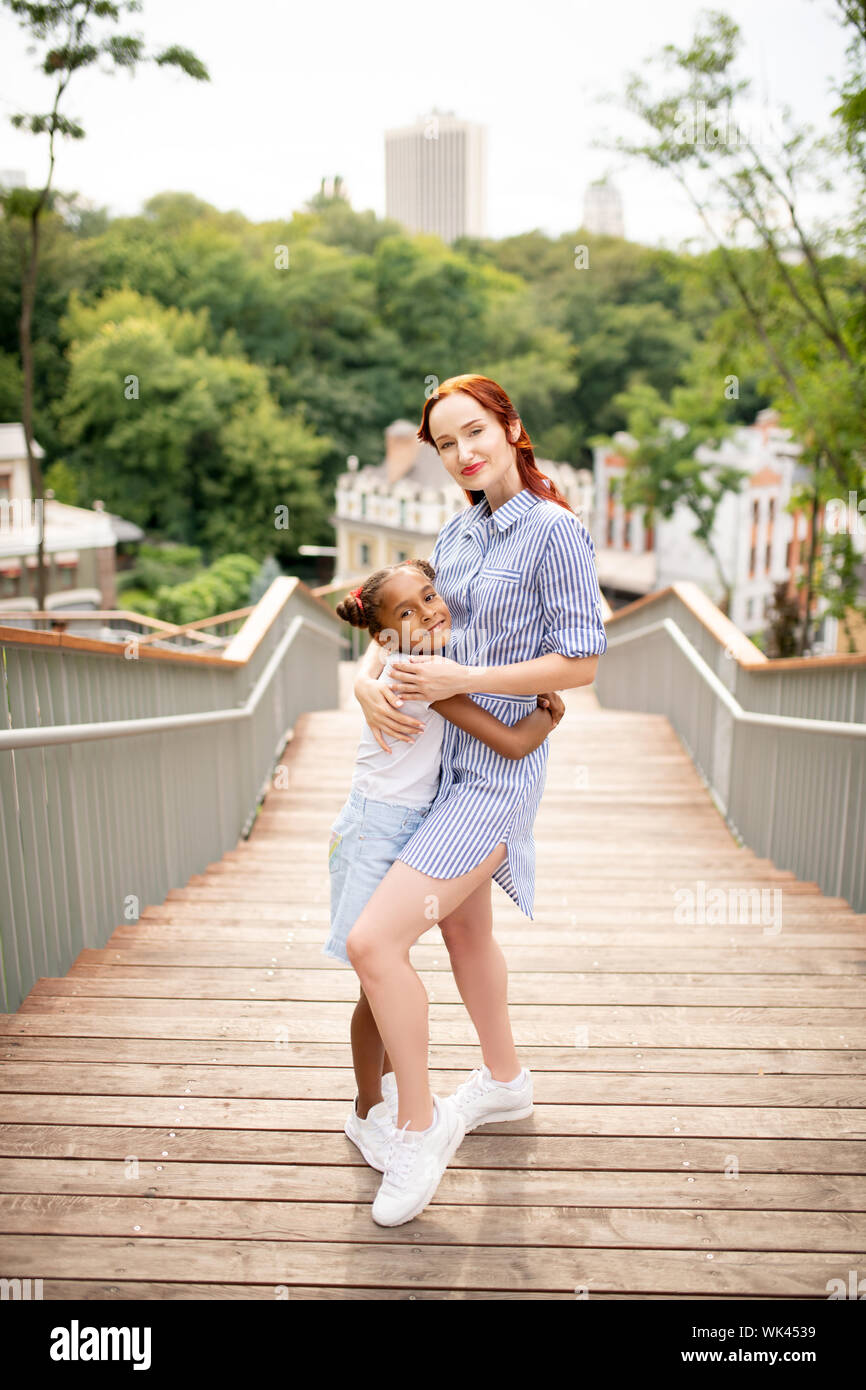 Mother girl hug adoption hi-res stock photography and images - Alamy