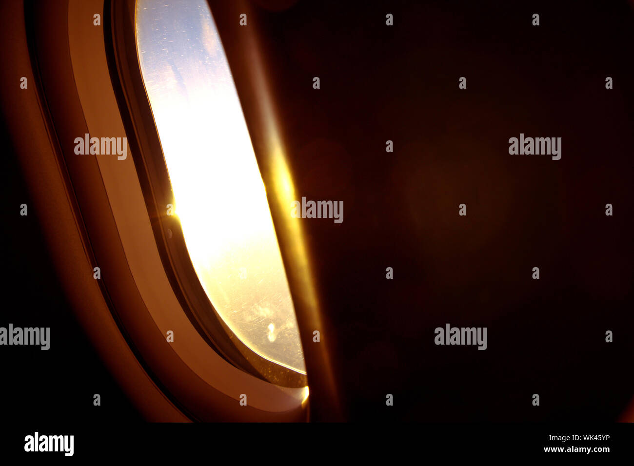 A view of the sunrise out an airplane window Stock Photo - Alamy