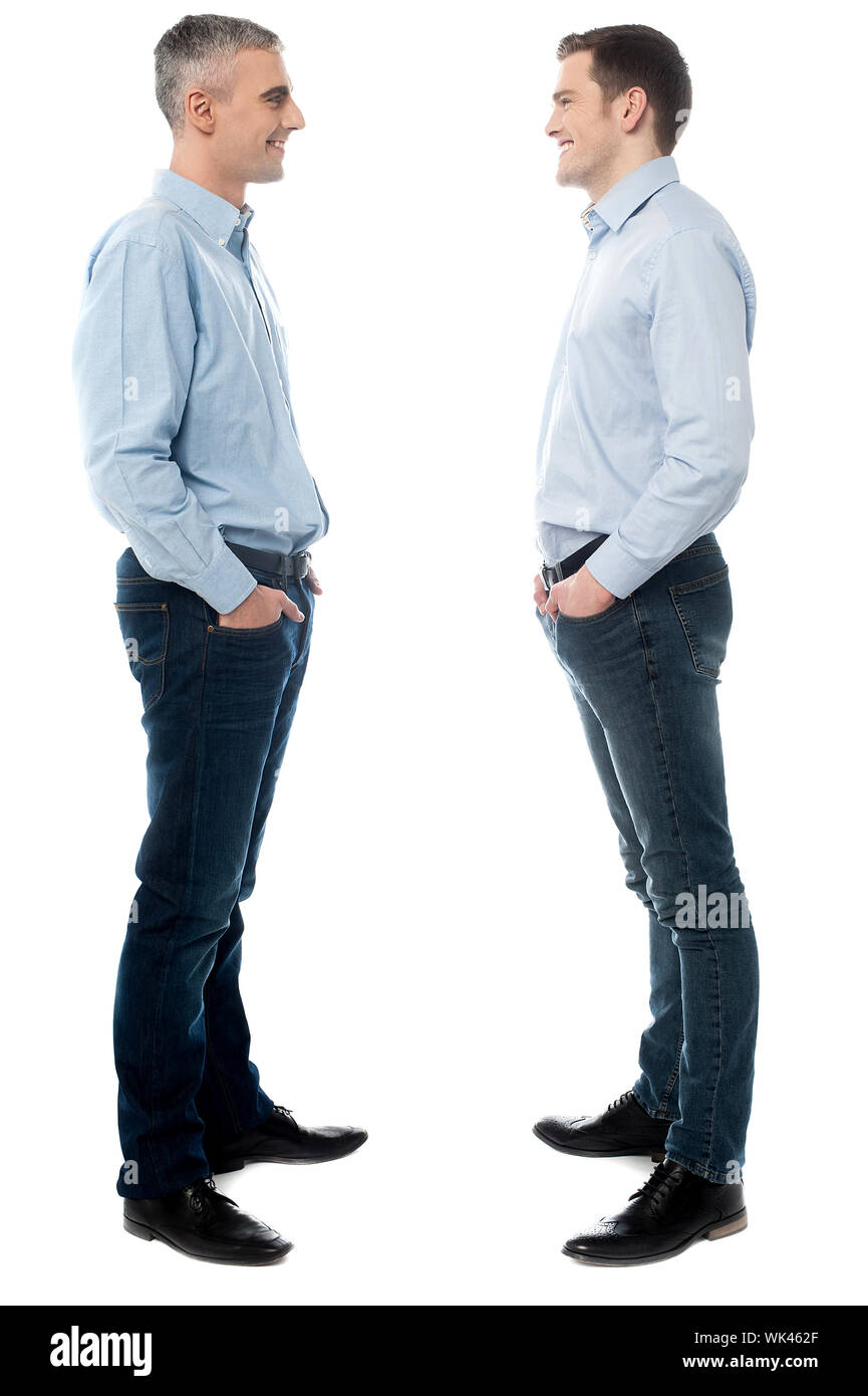 Full length of two executives standing on white background Stock Photo ...