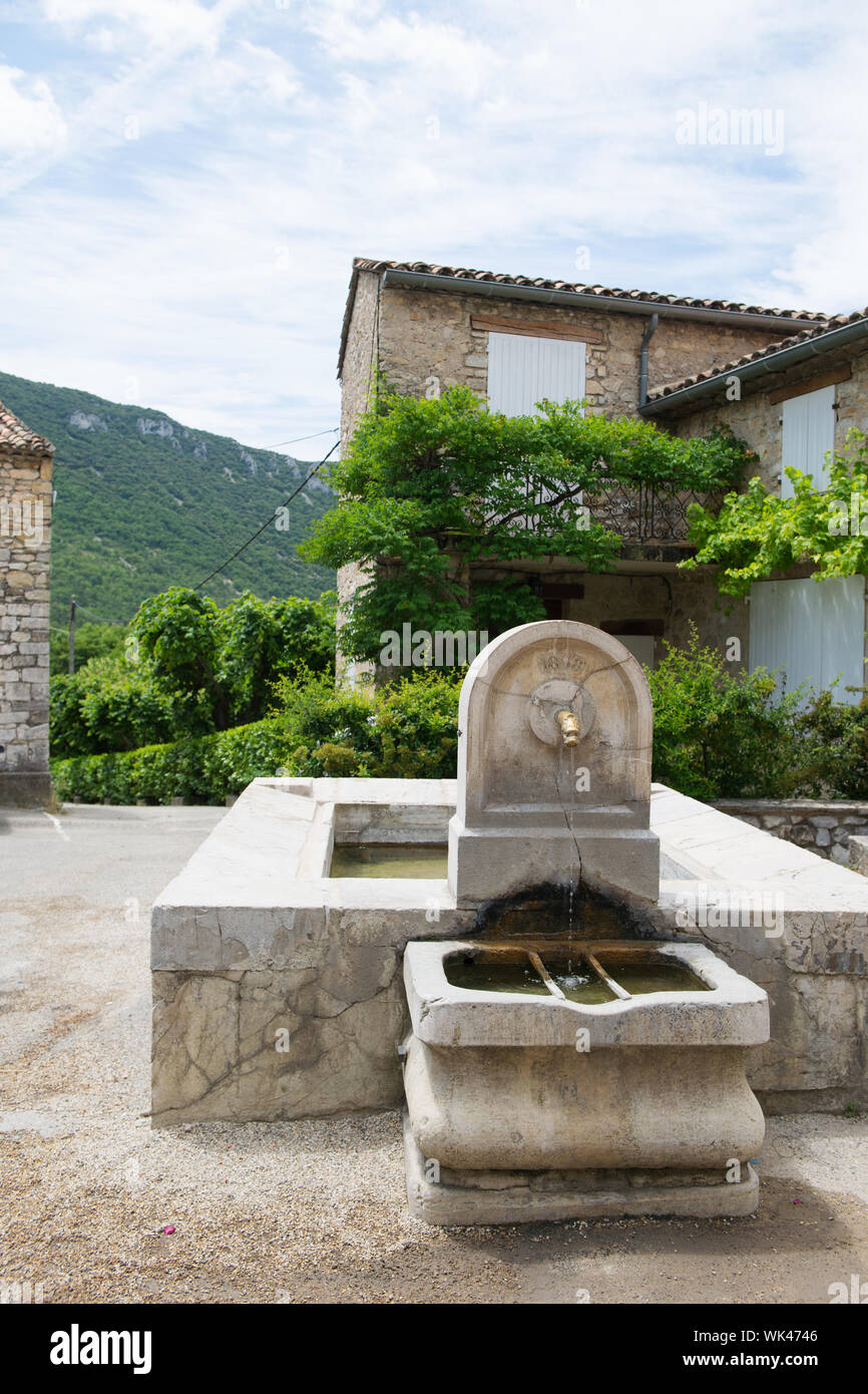 Roman water pump in French village Stock Photo - Alamy
