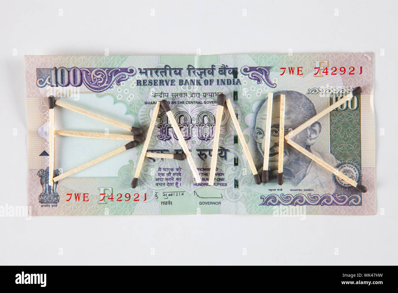 Bank text on an one thousand rupees note isolated on white background ...