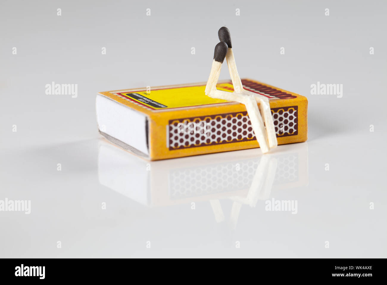 Two matchsticks represent love or friendship on a matchbox Stock Photo ...