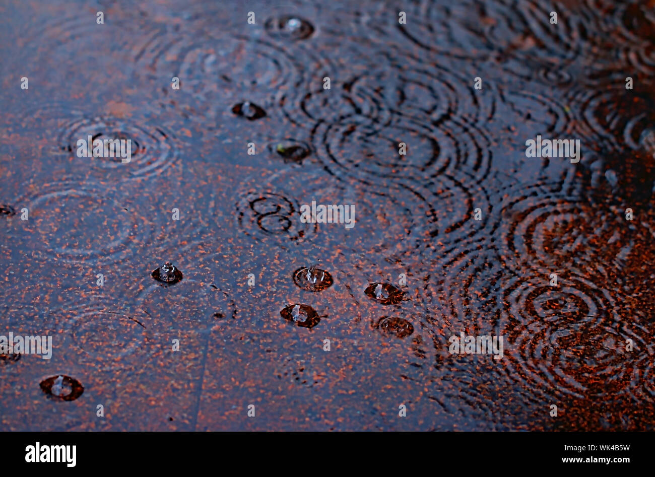Raindrops in puddle hi-res stock photography and images - Alamy