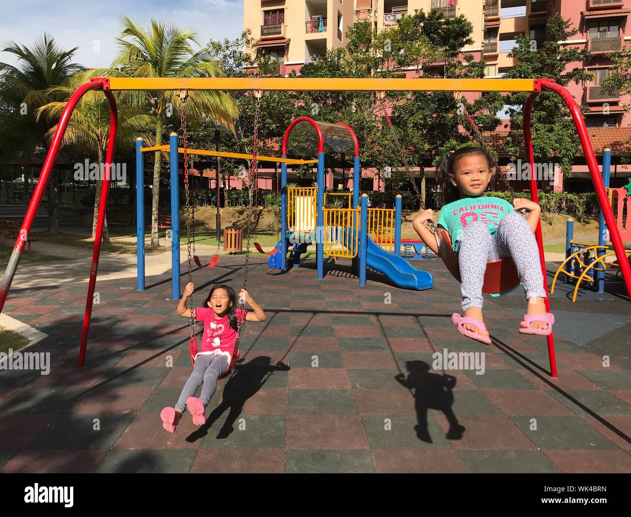 Children in swing hi-res stock photography and images - Alamy