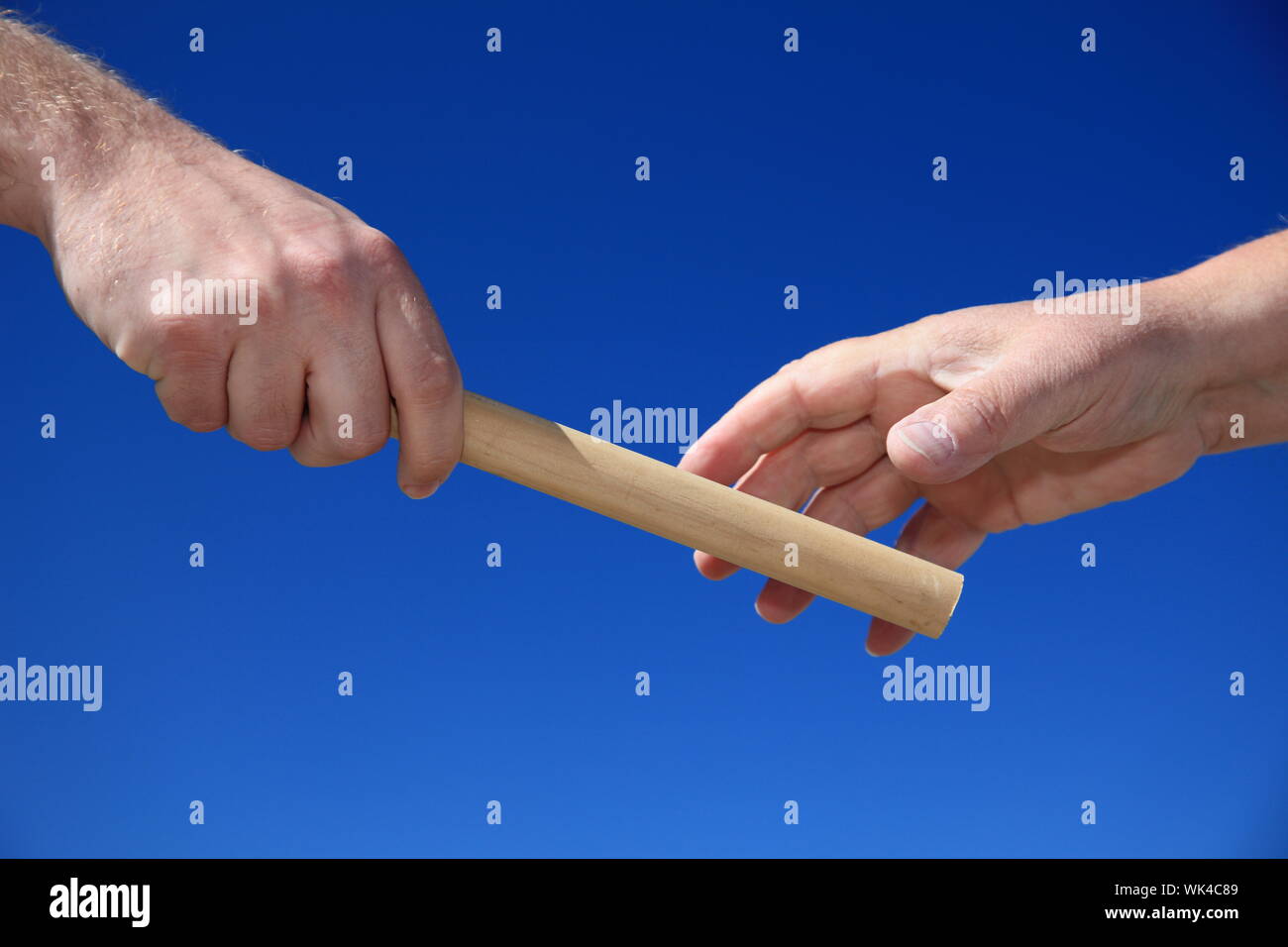 Human hand holding baton hi-res stock photography and images - Alamy