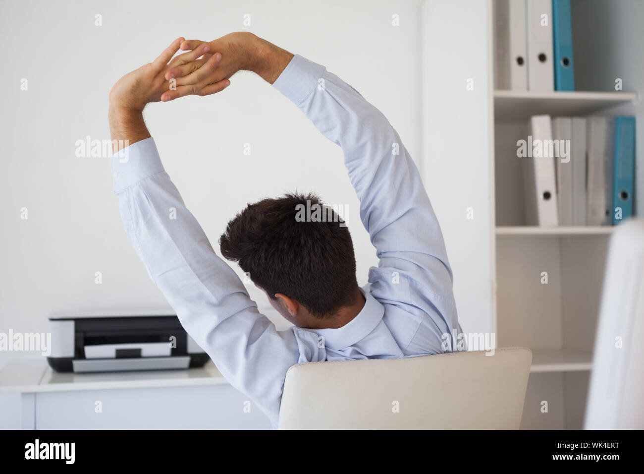 Relaxed businessman stretching arms hi-res stock photography and images ...