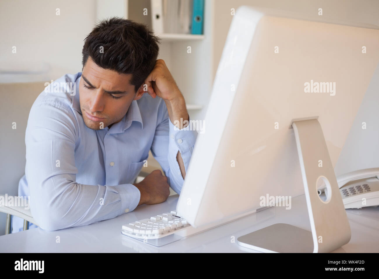 Man and slumped and chair hi-res stock photography and images - Alamy