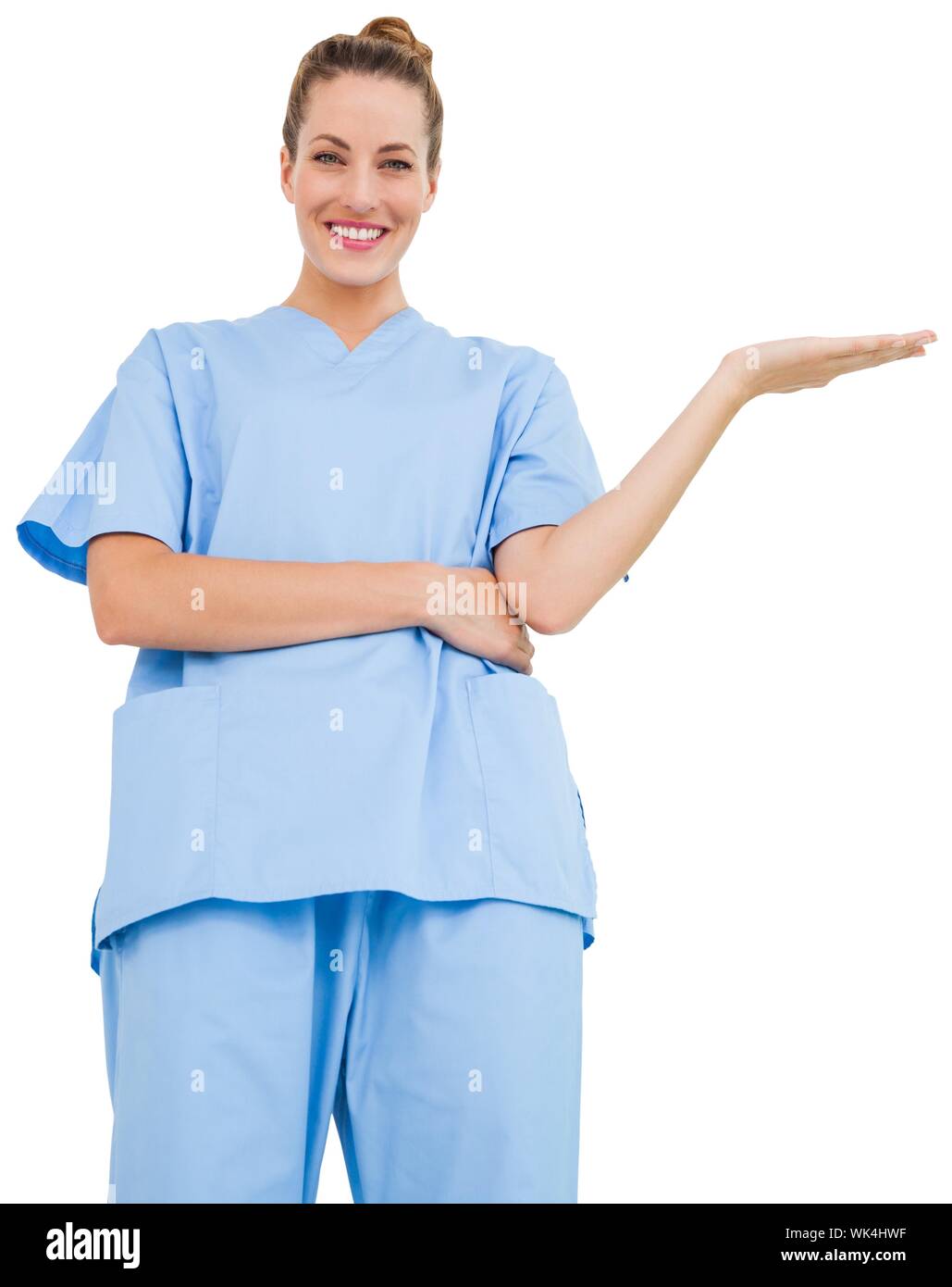 Pretty surgeon in blue scrubs presenting on white background Stock ...