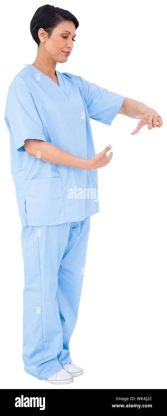 Pretty dark haired surgeon on white background Stock Photo - Alamy
