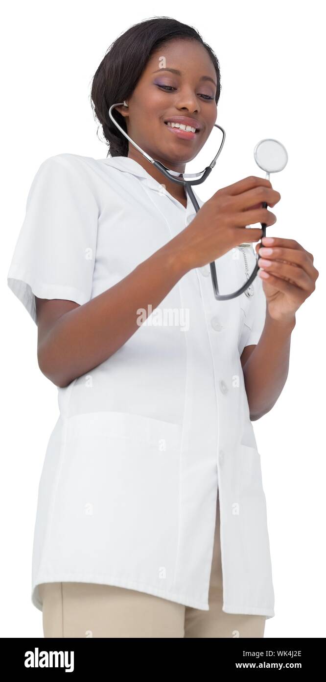 Young nurse listening with stethoscope on white background Stock Photo ...