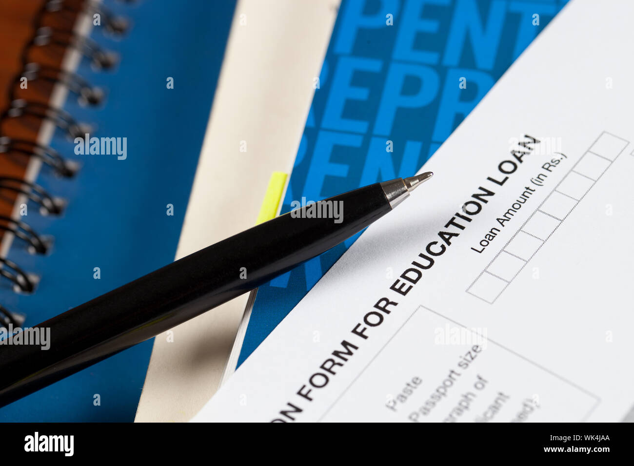 Education Loan application form with a pen and pencil Stock Photo - Alamy