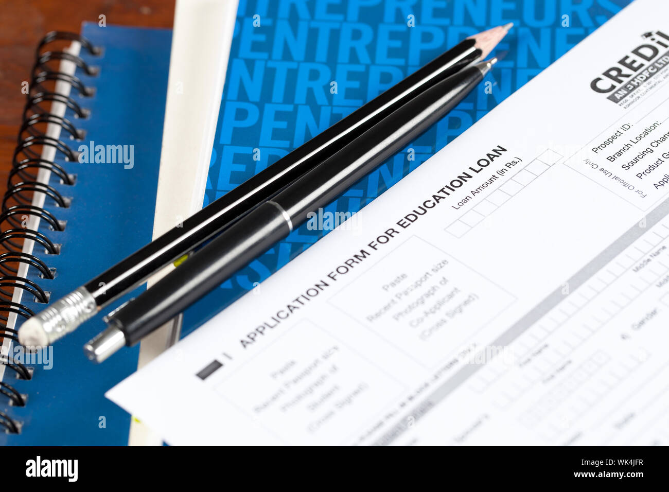 Education Loan application form with a pen and pencil Stock Photo - Alamy