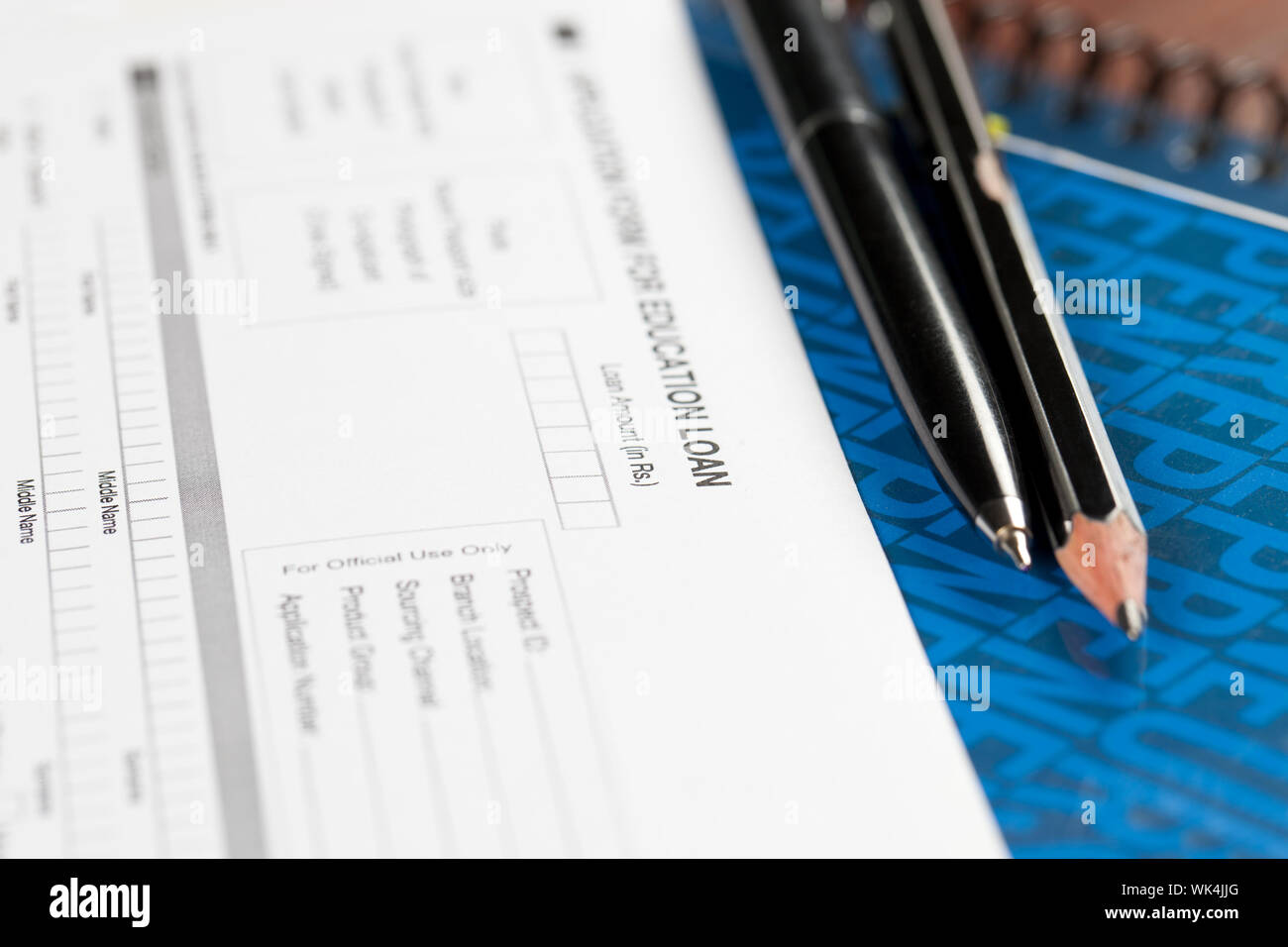 Education Loan application form with a pen and pencil Stock Photo - Alamy