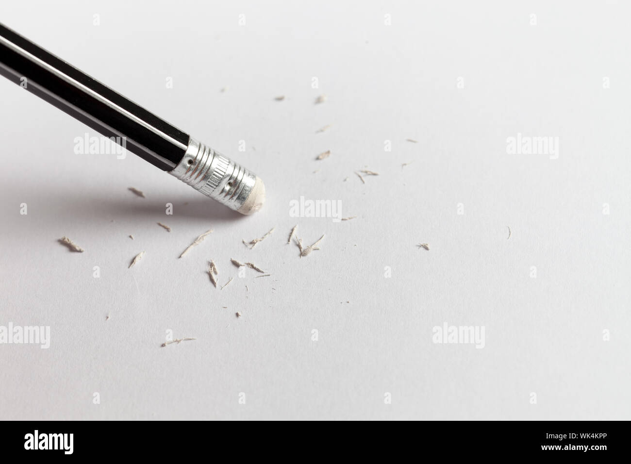 Studio shot of pencil erasing from piece of paper Stock Photo - Alamy