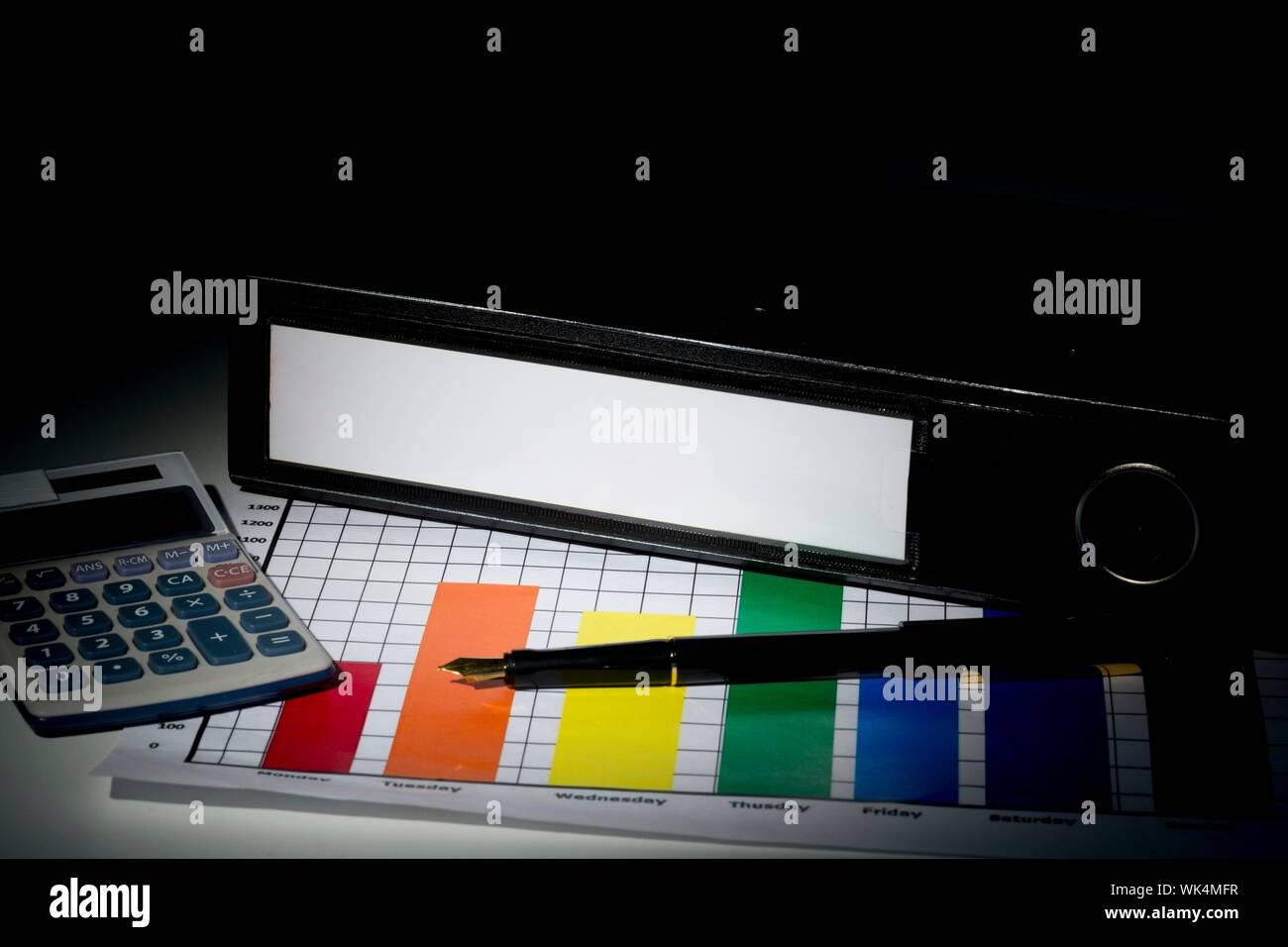 Business binder with paperwork pen and calculator Stock Photo - Alamy