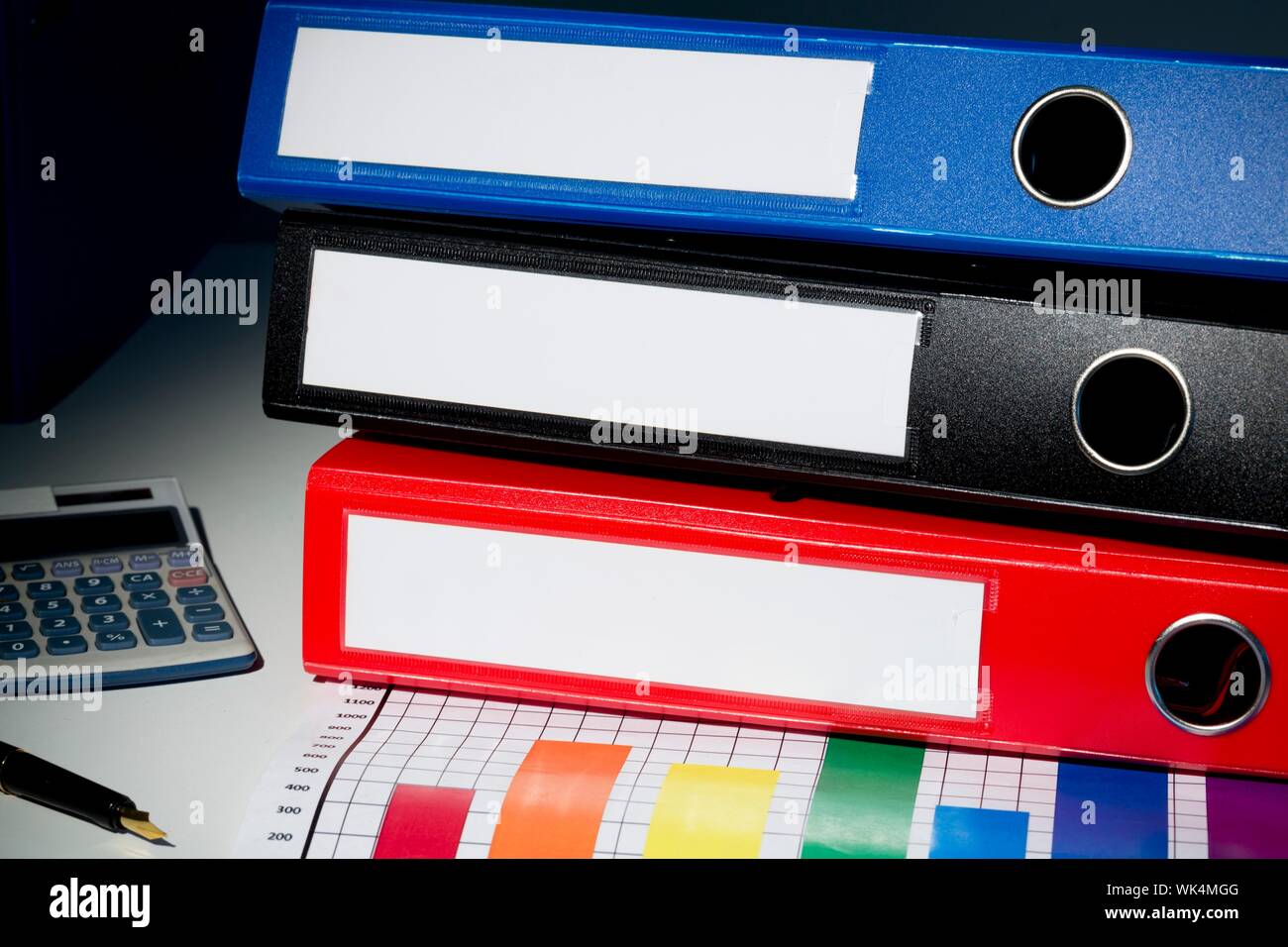 Business binders on desk with paperwork Stock Photo - Alamy
