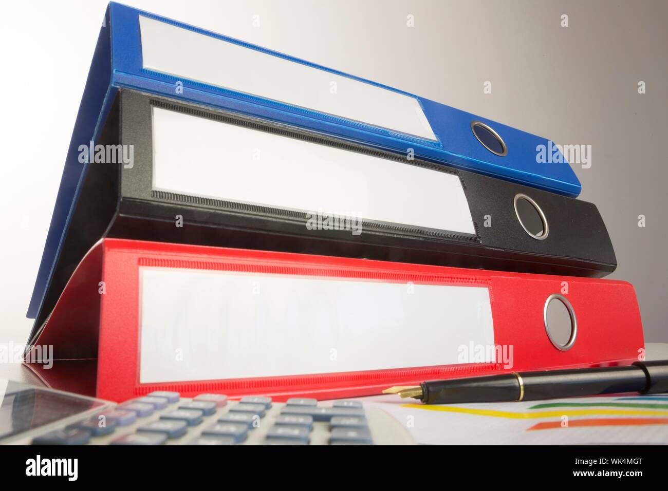 Stack of three business binders low angle view Stock Photo - Alamy