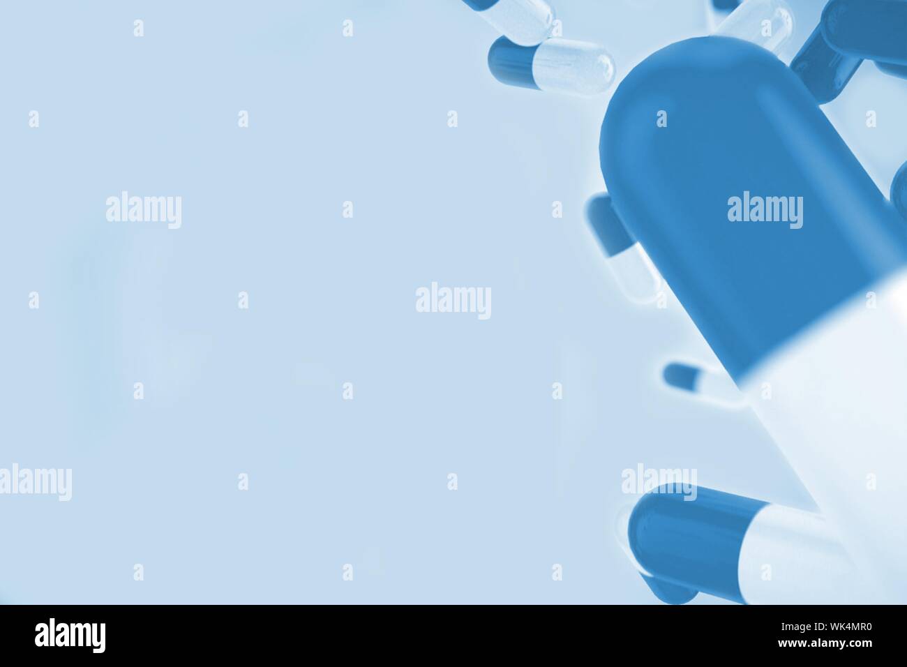 Digitally generated blue medical background with pills Stock Photo - Alamy