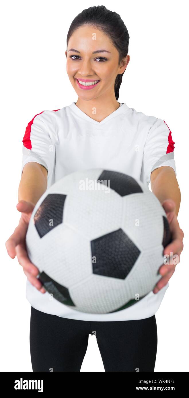 Pretty football fan in white smiling on white background Stock Photo ...
