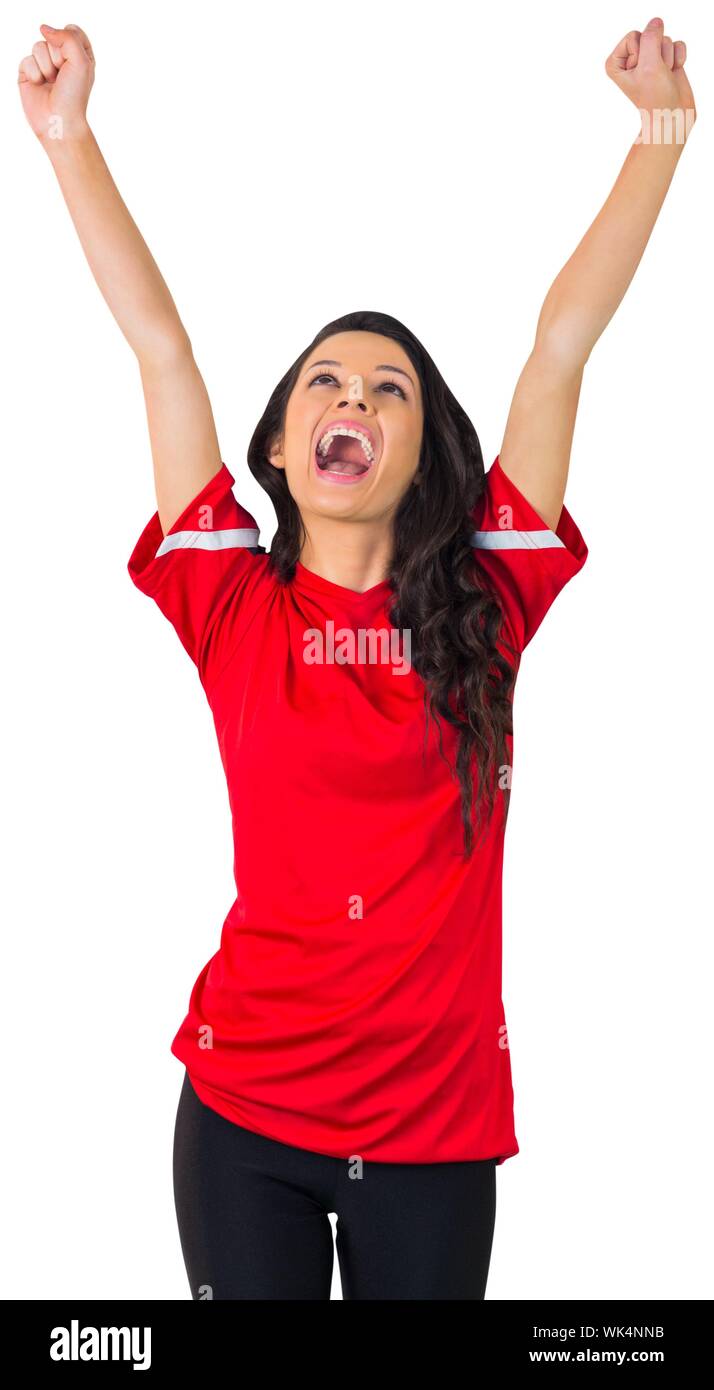 Cheering football fan in red on white background Stock Photo - Alamy