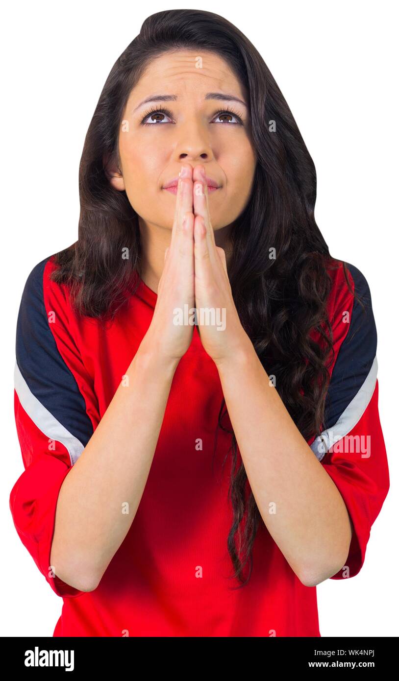 Nervous football fan in red on white background Stock Photo - Alamy