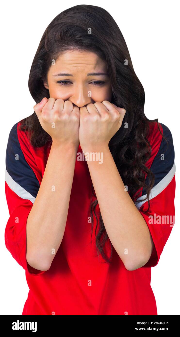 Nervous football fan in red on white background Stock Photo - Alamy