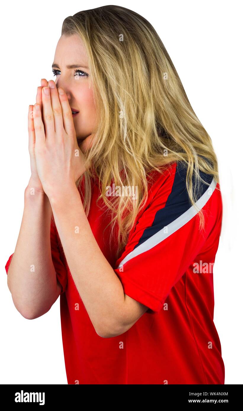 Nervous football fan in red on white background Stock Photo - Alamy