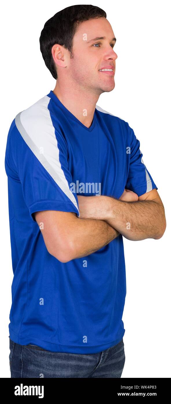 Smiling football fan in blue on white background Stock Photo - Alamy