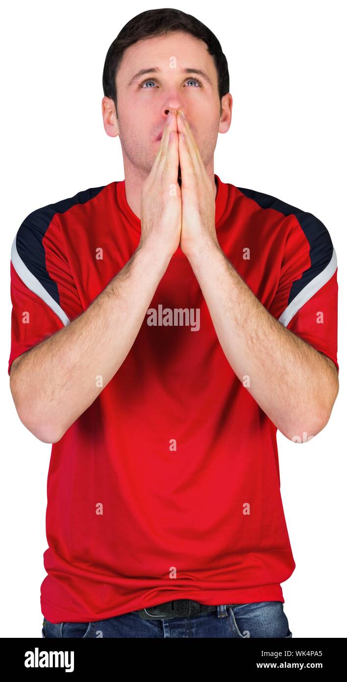 Nervous football fan in red on white background Stock Photo - Alamy