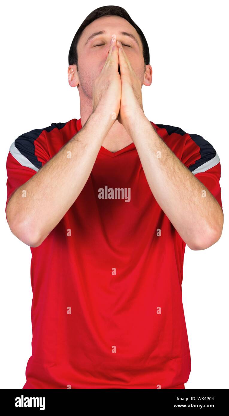 Nervous football fan in red on white background Stock Photo - Alamy