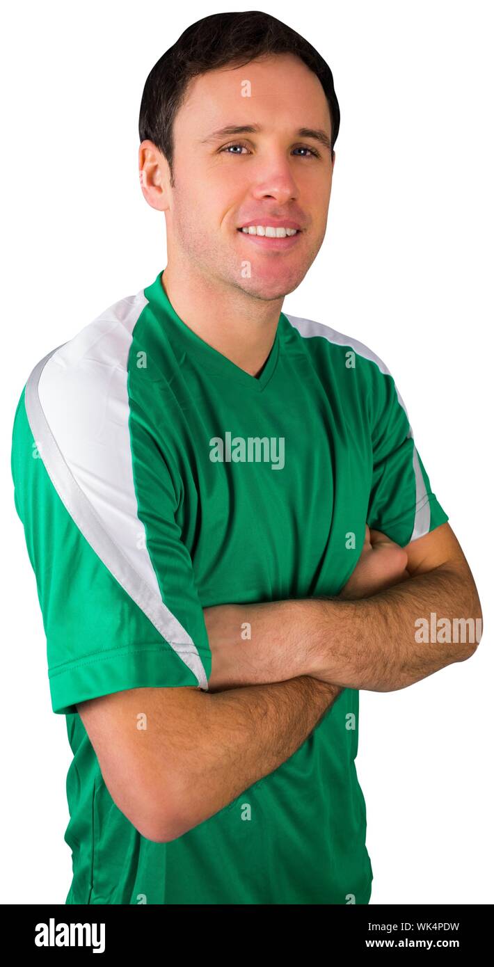 Handsome football fan in green on white background Stock Photo - Alamy