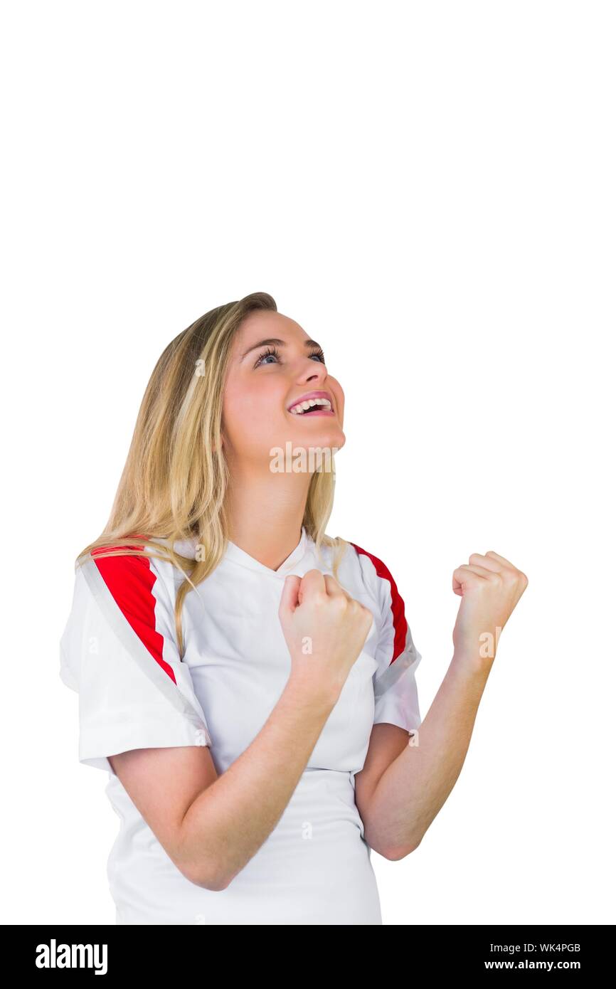 Pretty football fan in white cheering on white background Stock Photo ...