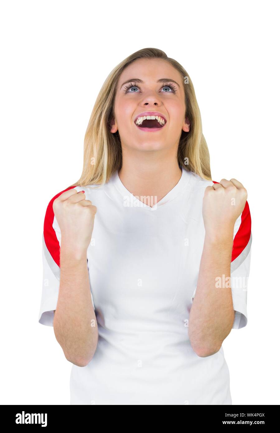 Pretty football fan in white cheering on white background Stock Photo ...
