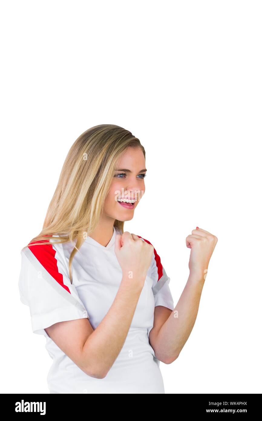 Pretty football fan in white cheering on white background Stock Photo ...