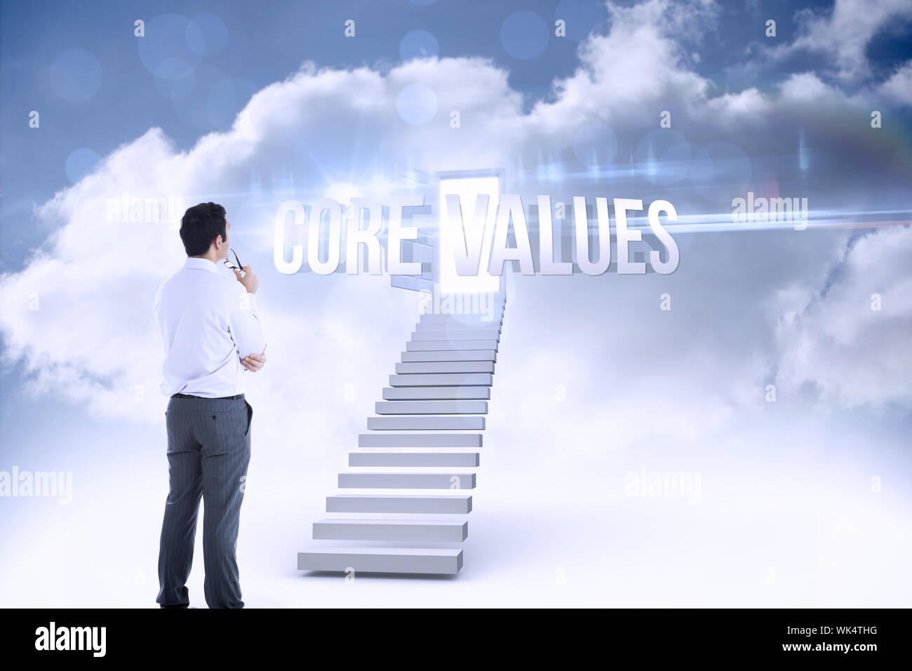 The word core values and businessman holding glasses against open door ...