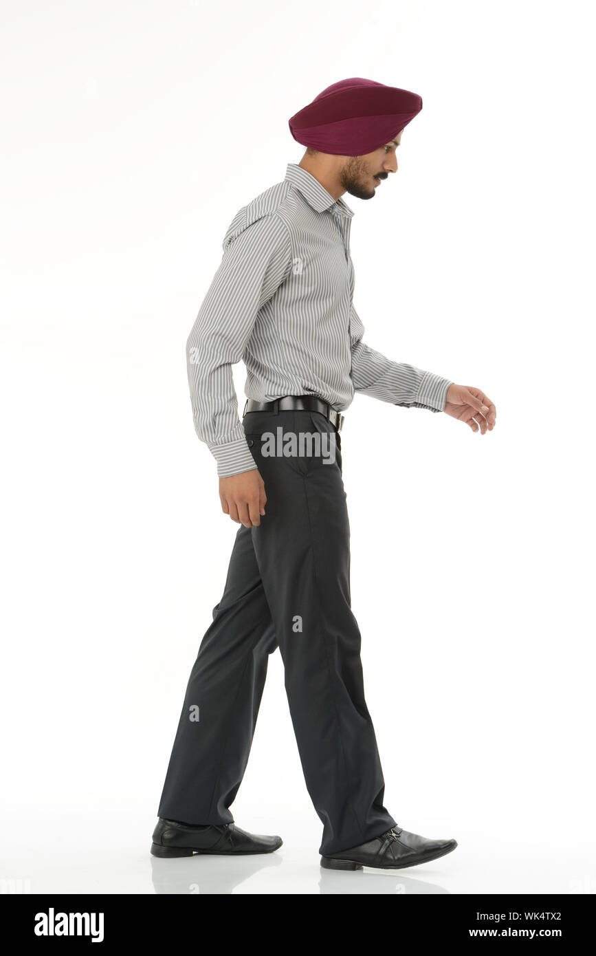 Indian man walking side view hi-res stock photography and images - Alamy