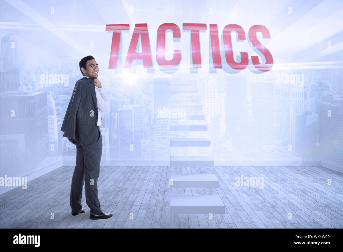 The word tactics and smiling businessman standing against city scene in ...