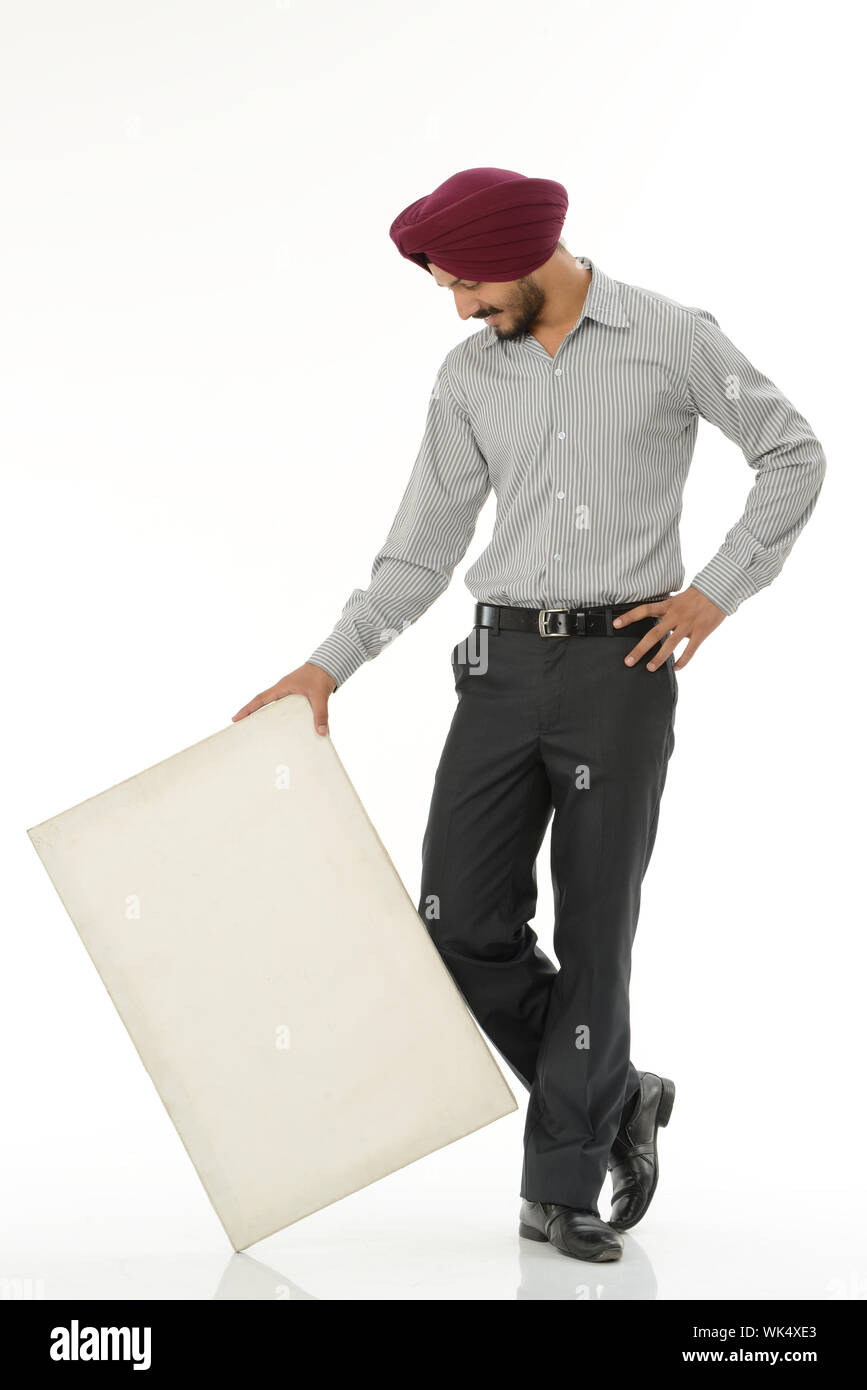 Young man showing a placard Stock Photo - Alamy