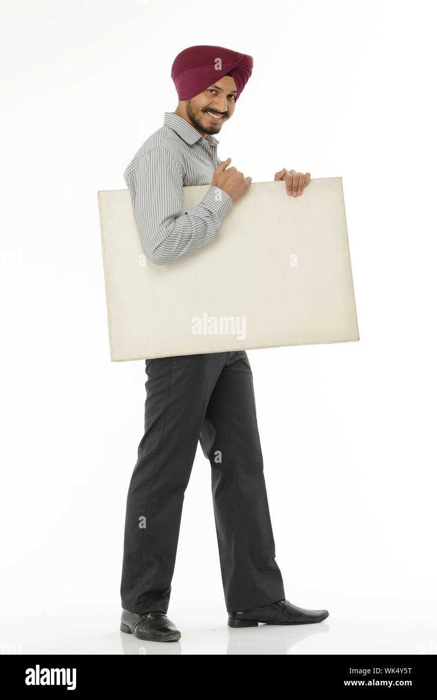 Young man showing a placard Stock Photo - Alamy
