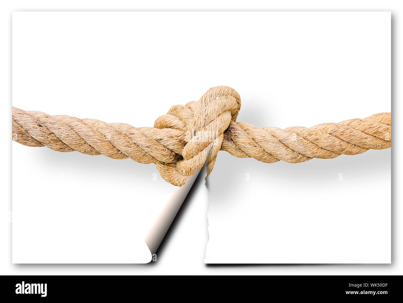 Cut the gordian knot - problem solving concept image with a ripped ...