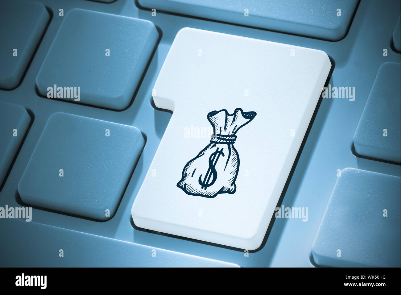 Money bag against white enter key on keyboard Stock Photo - Alamy