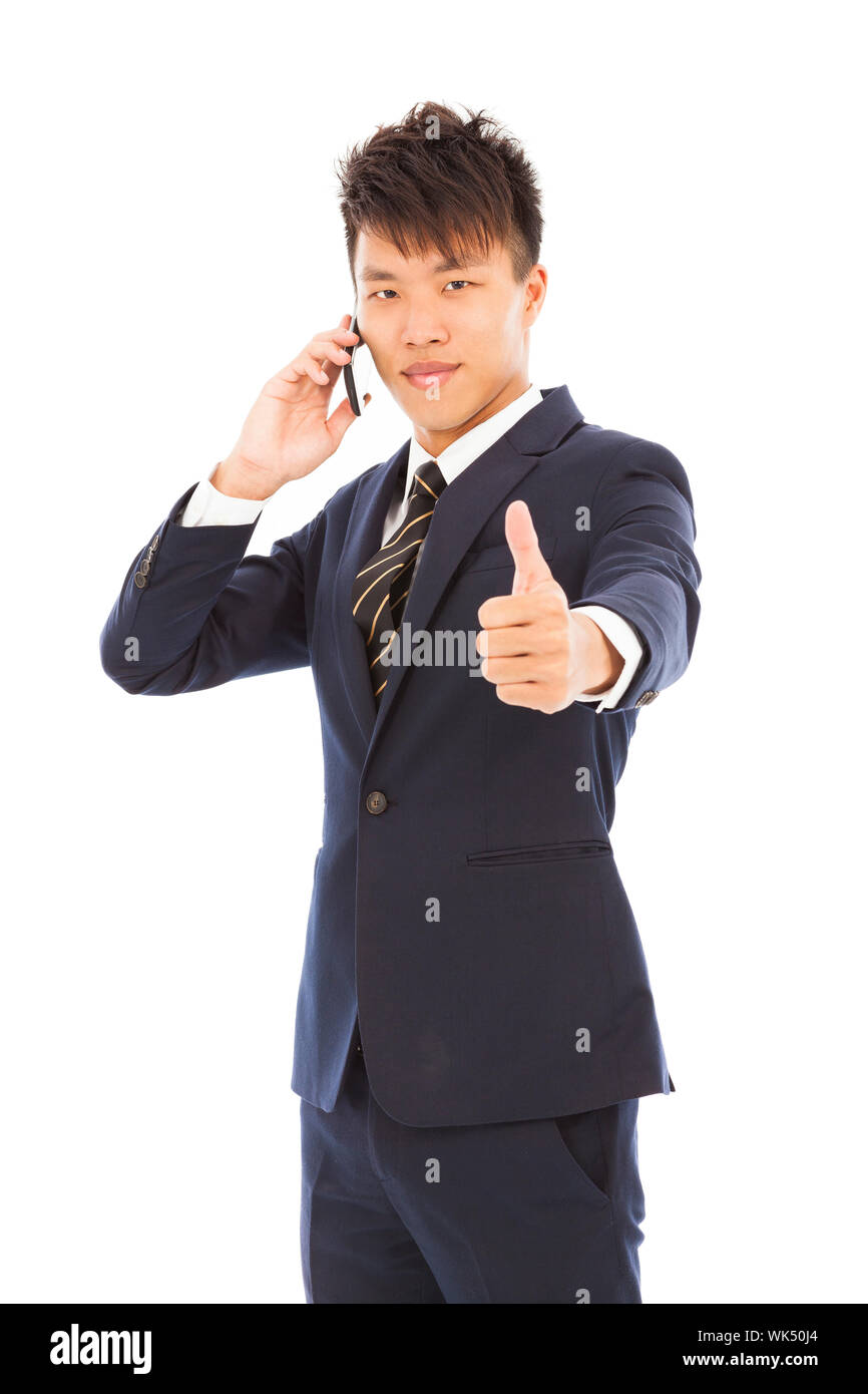young businessman talking on the phone with thumb up Stock Photo - Alamy