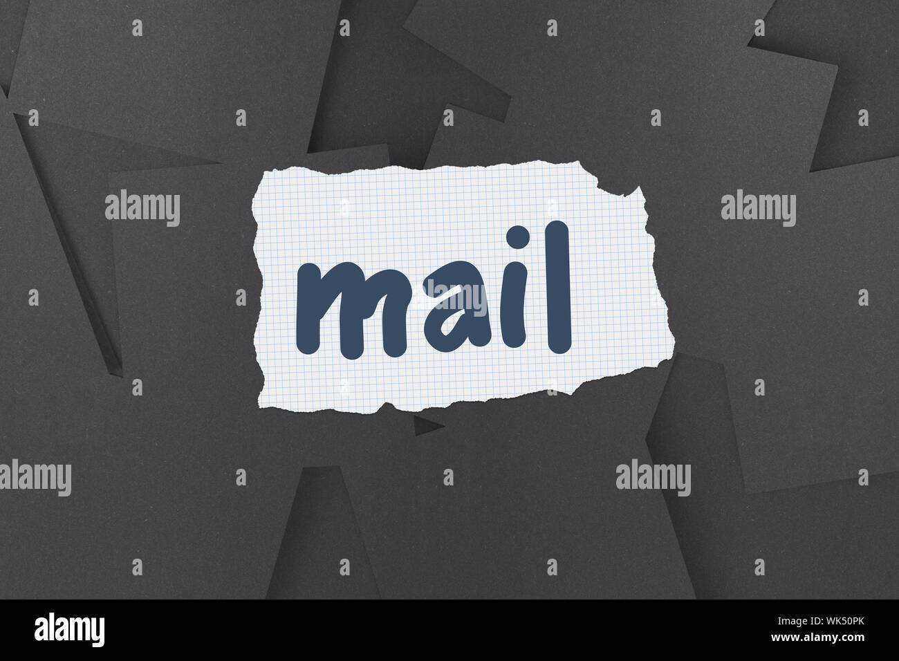 The word mail against digitally generated grey paper strewn Stock Photo ...